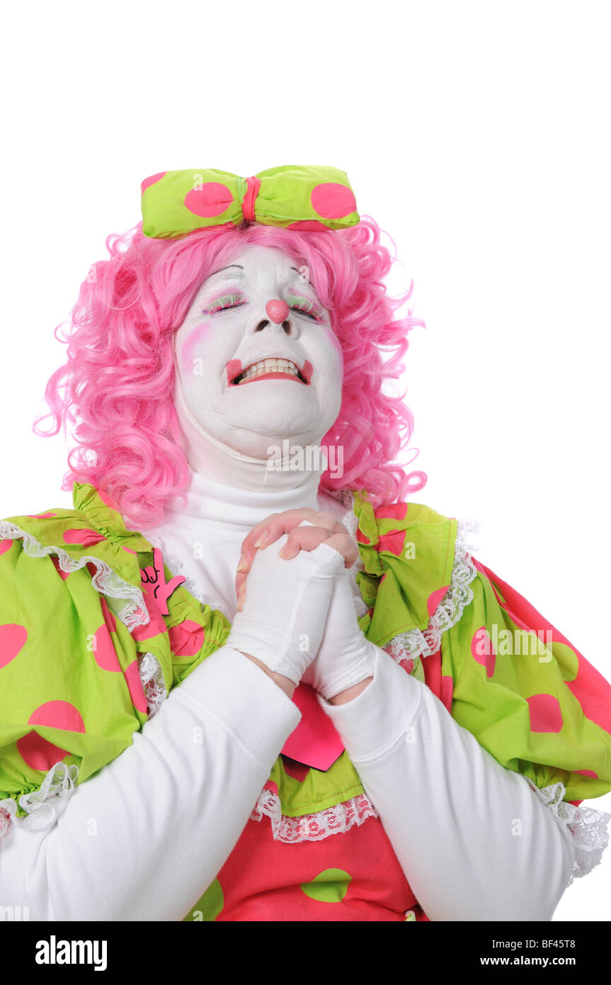 Clown praying with hands clasped isolated over a white background Stock ...
