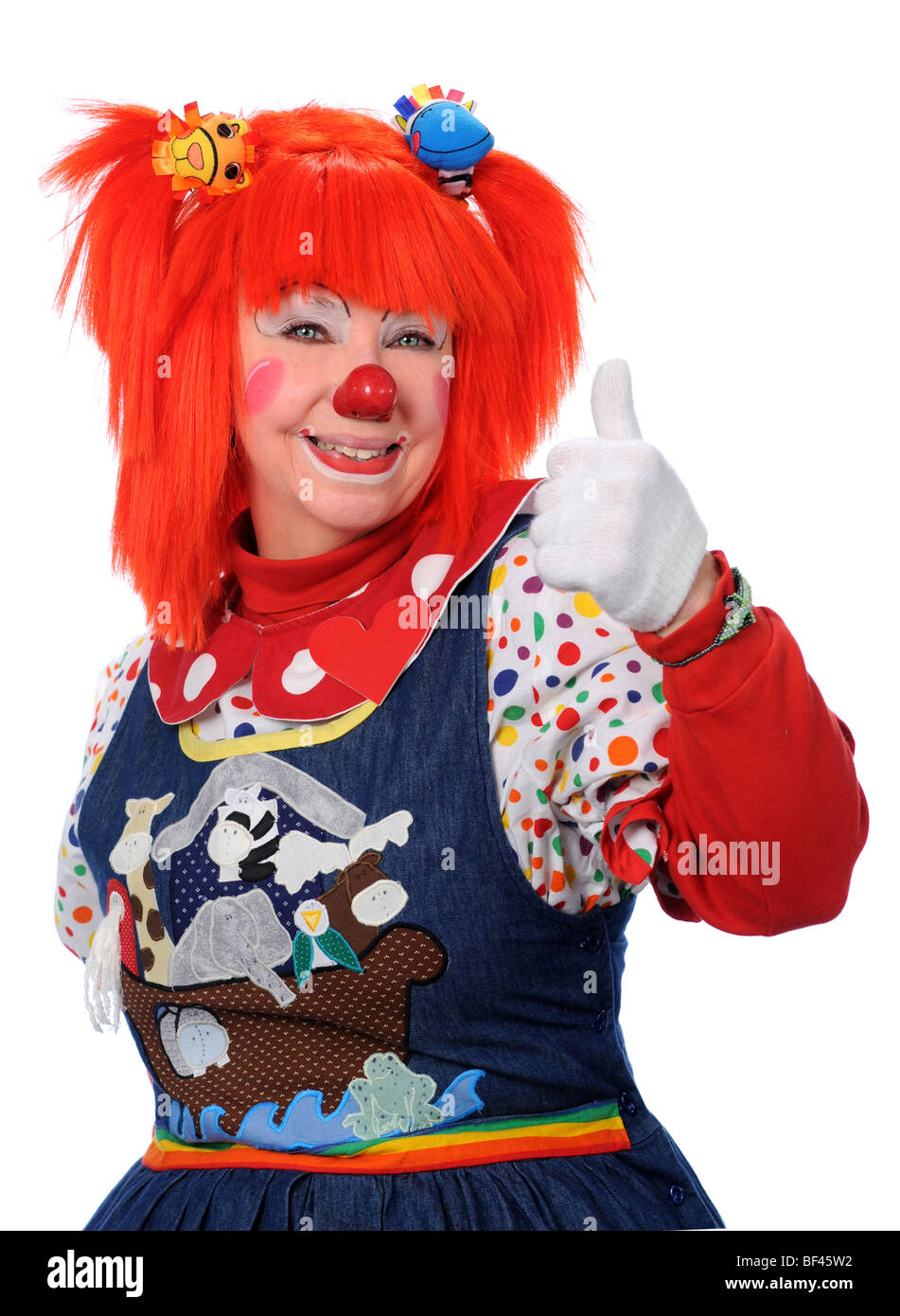 Smiling clown with orange hair showing approval Stock Photo - Alamy