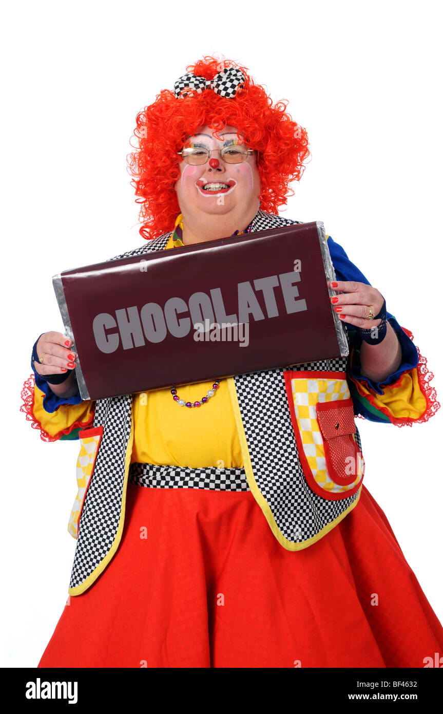 Clown holding big chocolate bar Stock Photo - Alamy