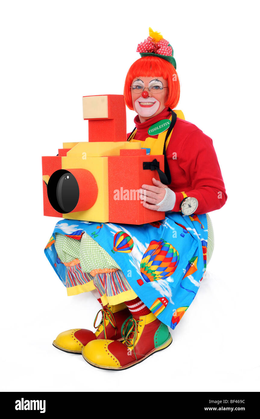 Clown with large toy camera over a white background Stock Photo - Alamy