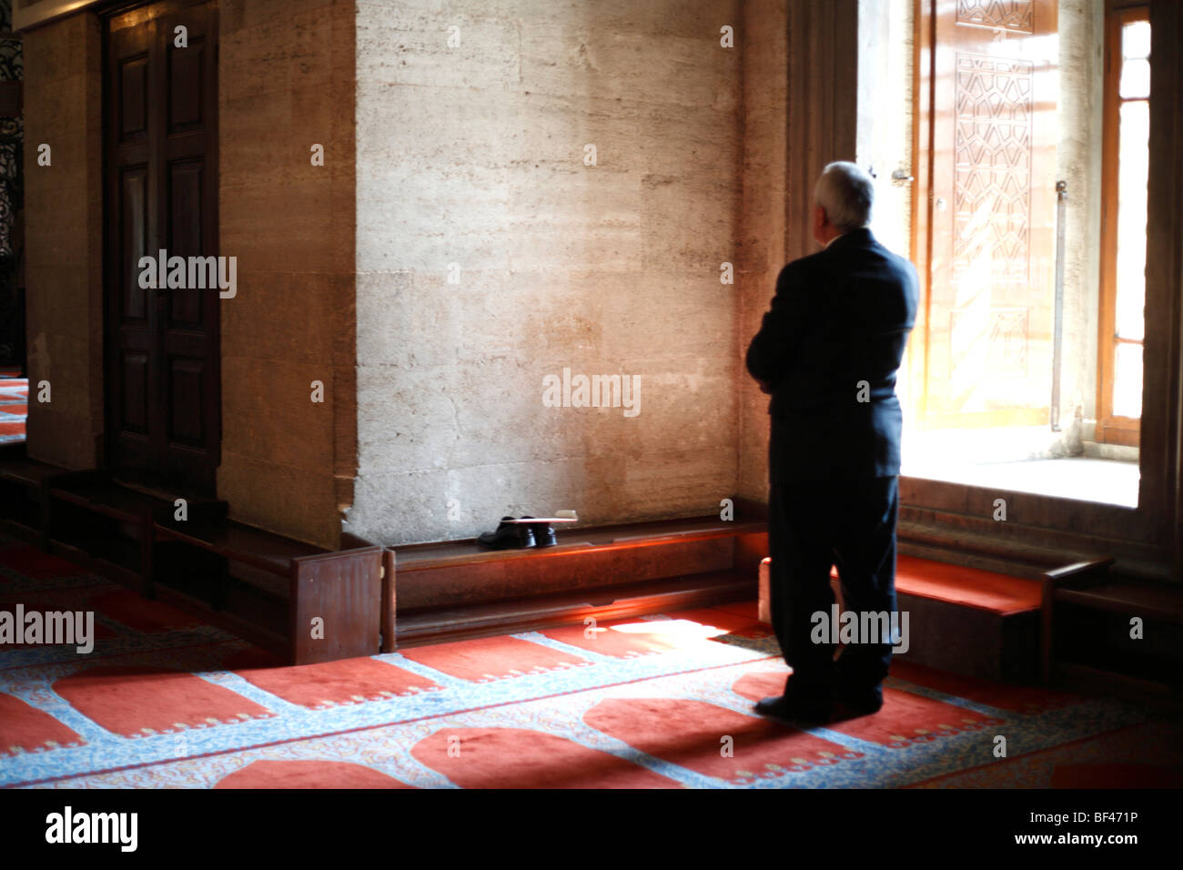 men in the mosque,mosque,touristic,old men,practicing,praying,carpet ...