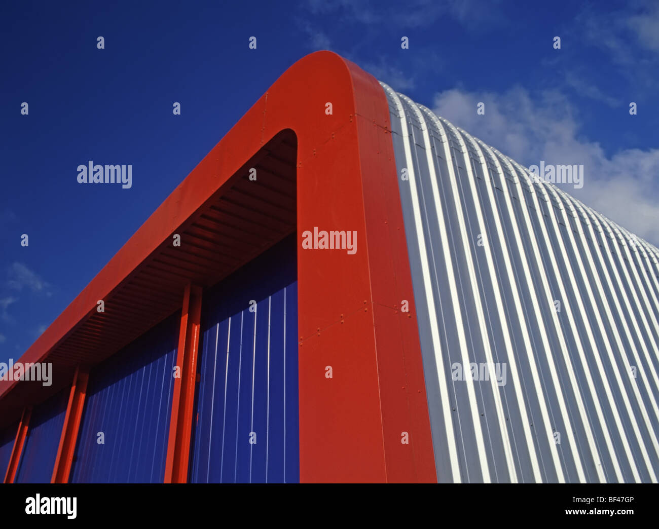 Red and blue colour scheme on corner detail of modern industrial ...