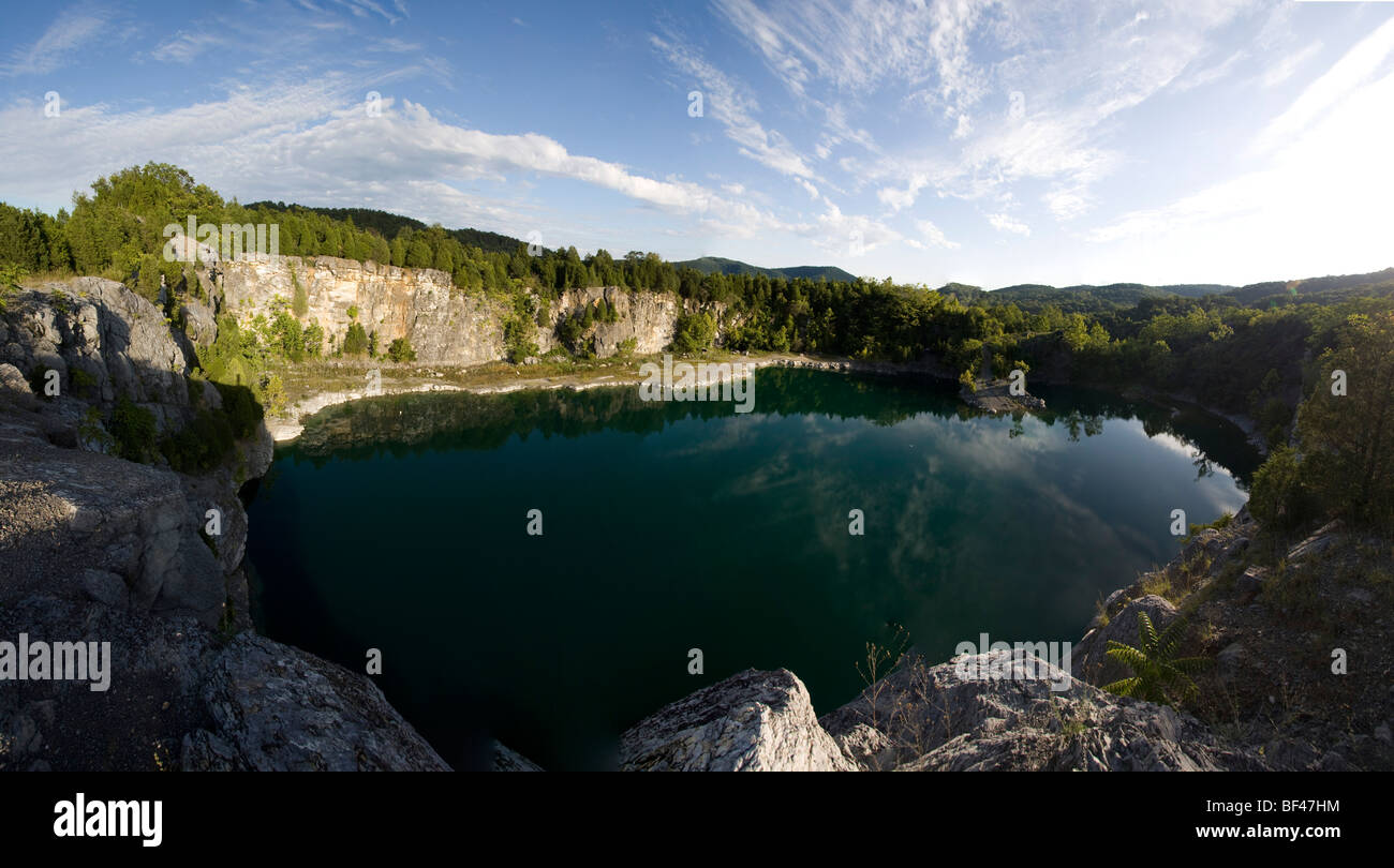 Dark blue water in an old quarry Stock Photo - Alamy
