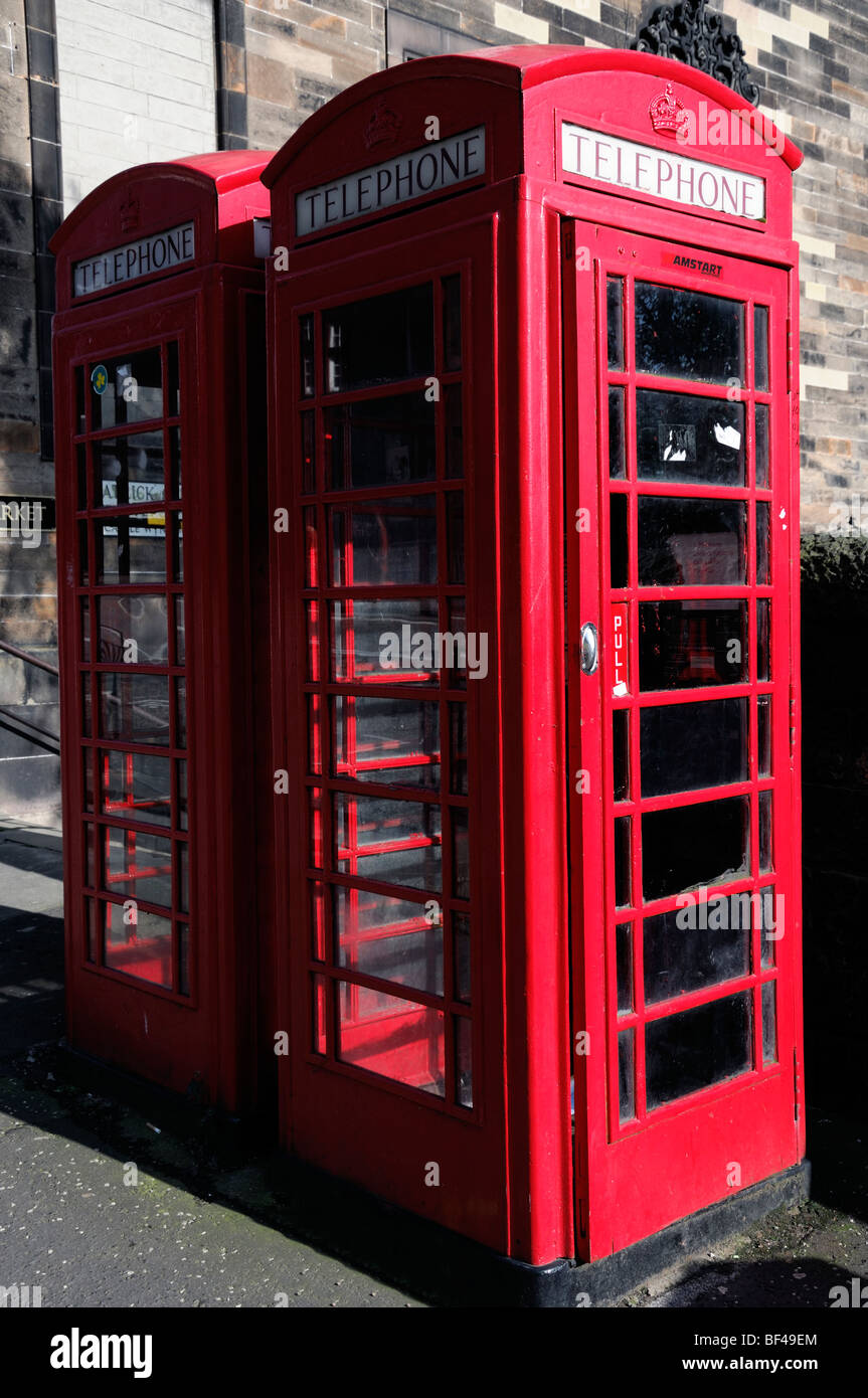 Traditional English red phone box two pair closed Stock Photo - Alamy
