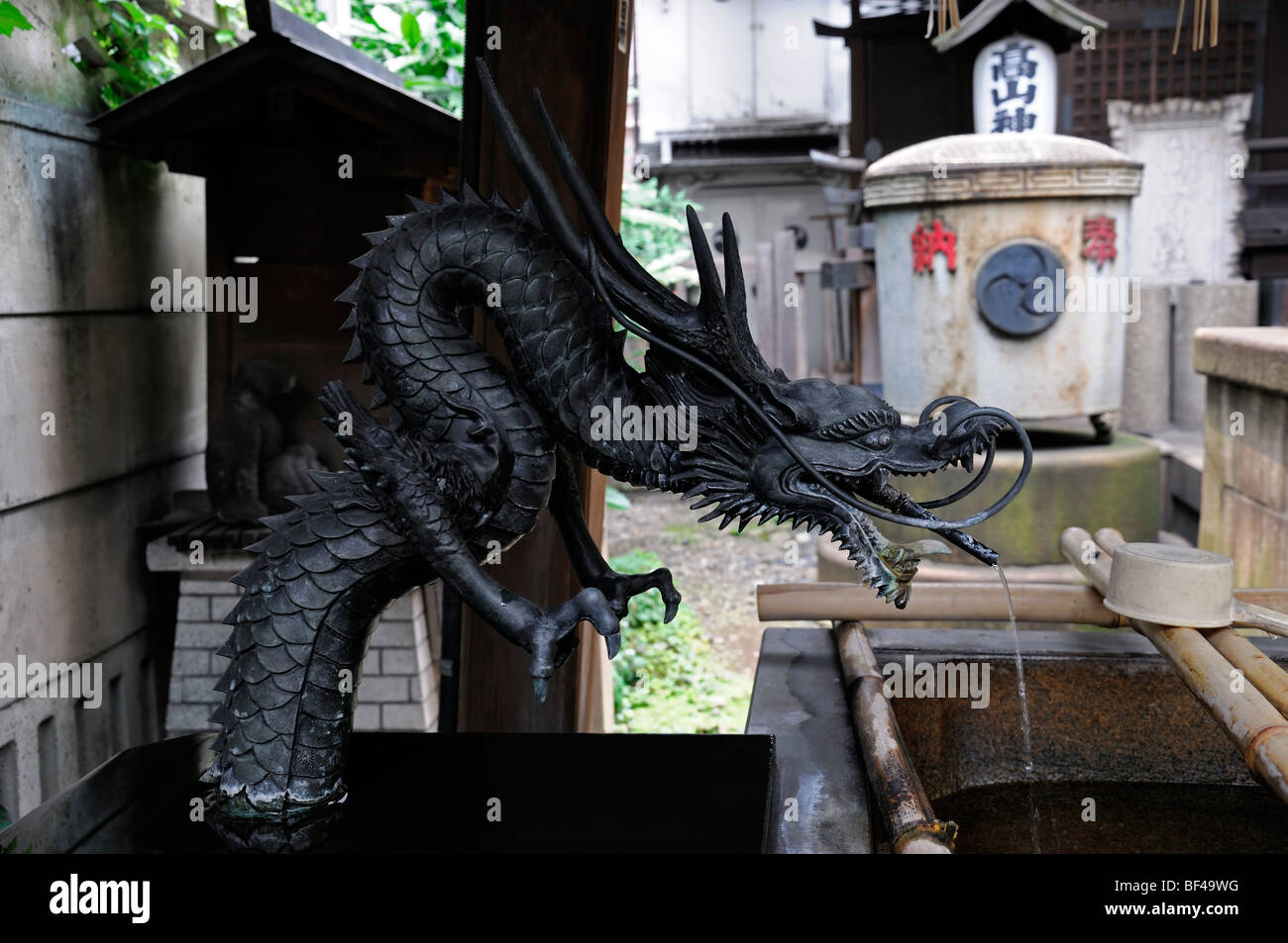 An intricately carved and detailed dragon shaped water fountain with in ...