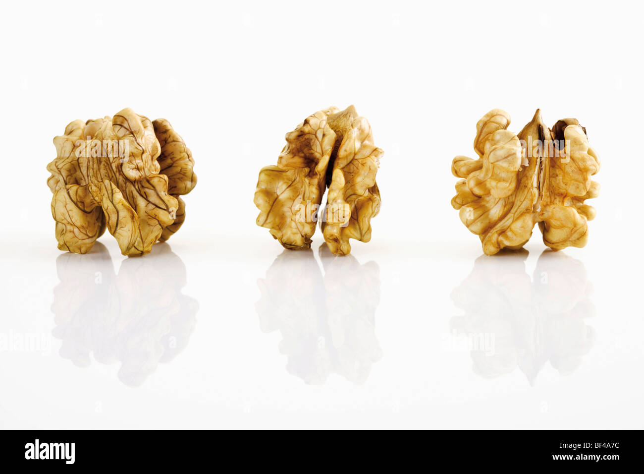 Three walnut nuts Stock Photo - Alamy