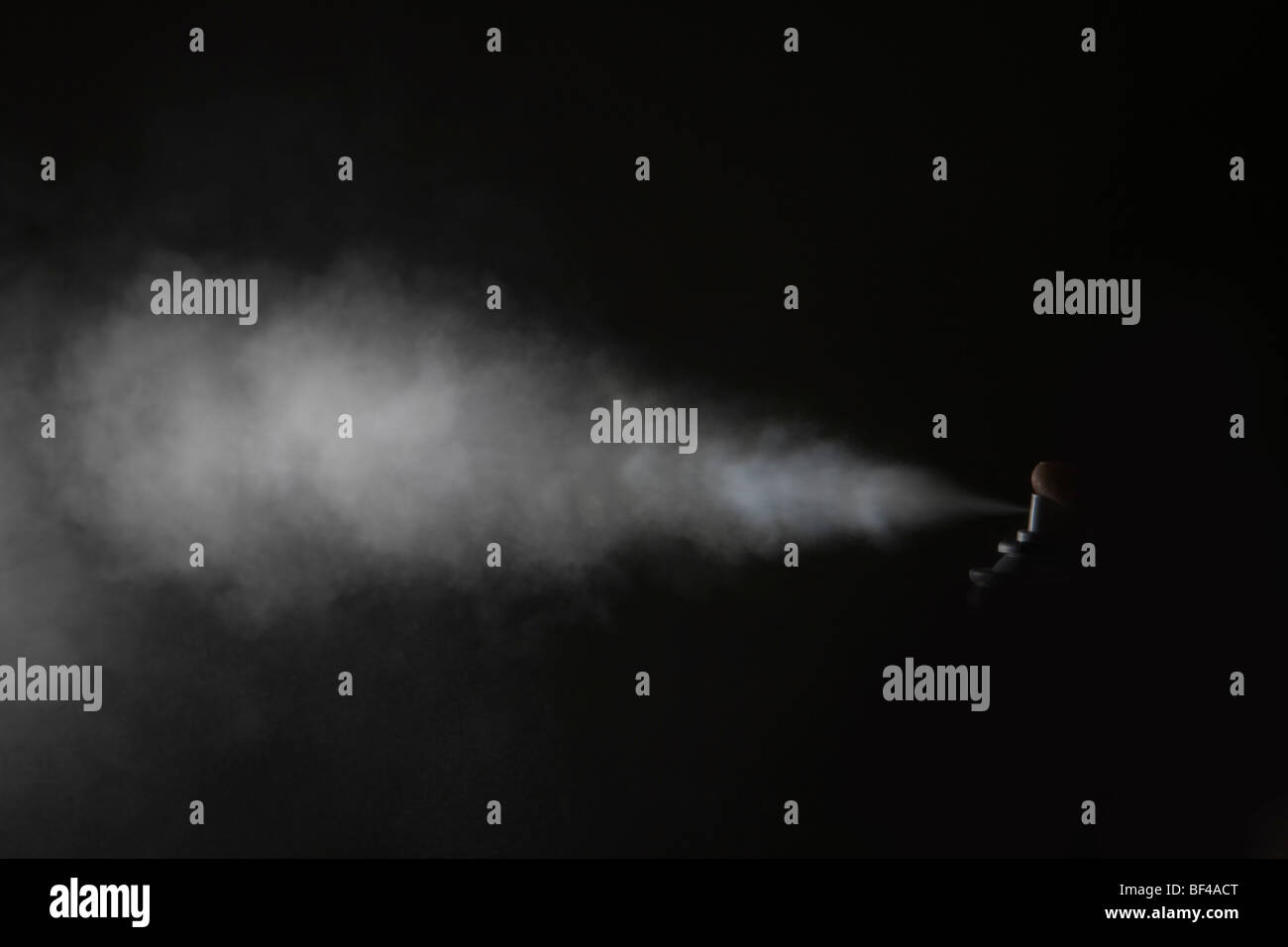 can with a jet of spray coming out Stock Photo - Alamy