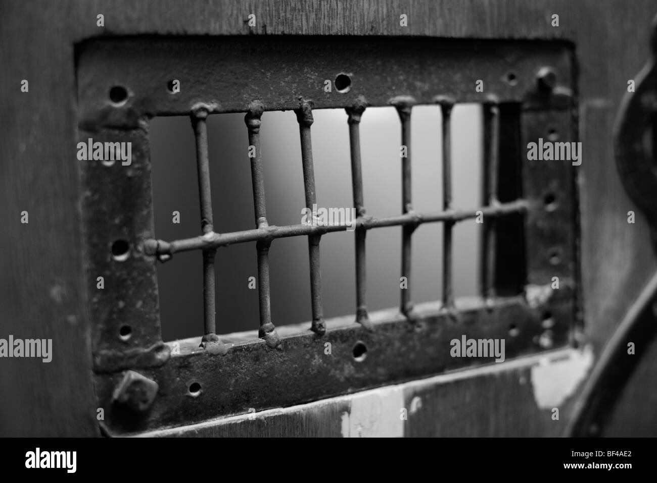 Grill in the door of a cell in the Bunker punishment block at Dachau ...