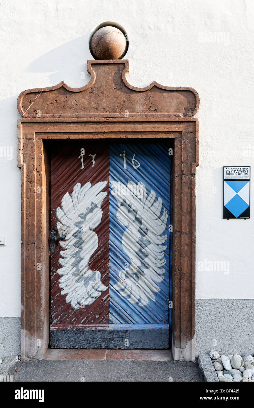 Historic stone portal with a painted wooden door, Benediktinerabtei ...