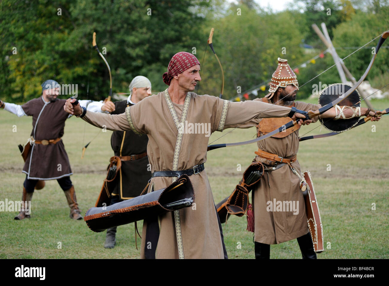 Archers demonstrating traditional fighting techniques with bow and ...