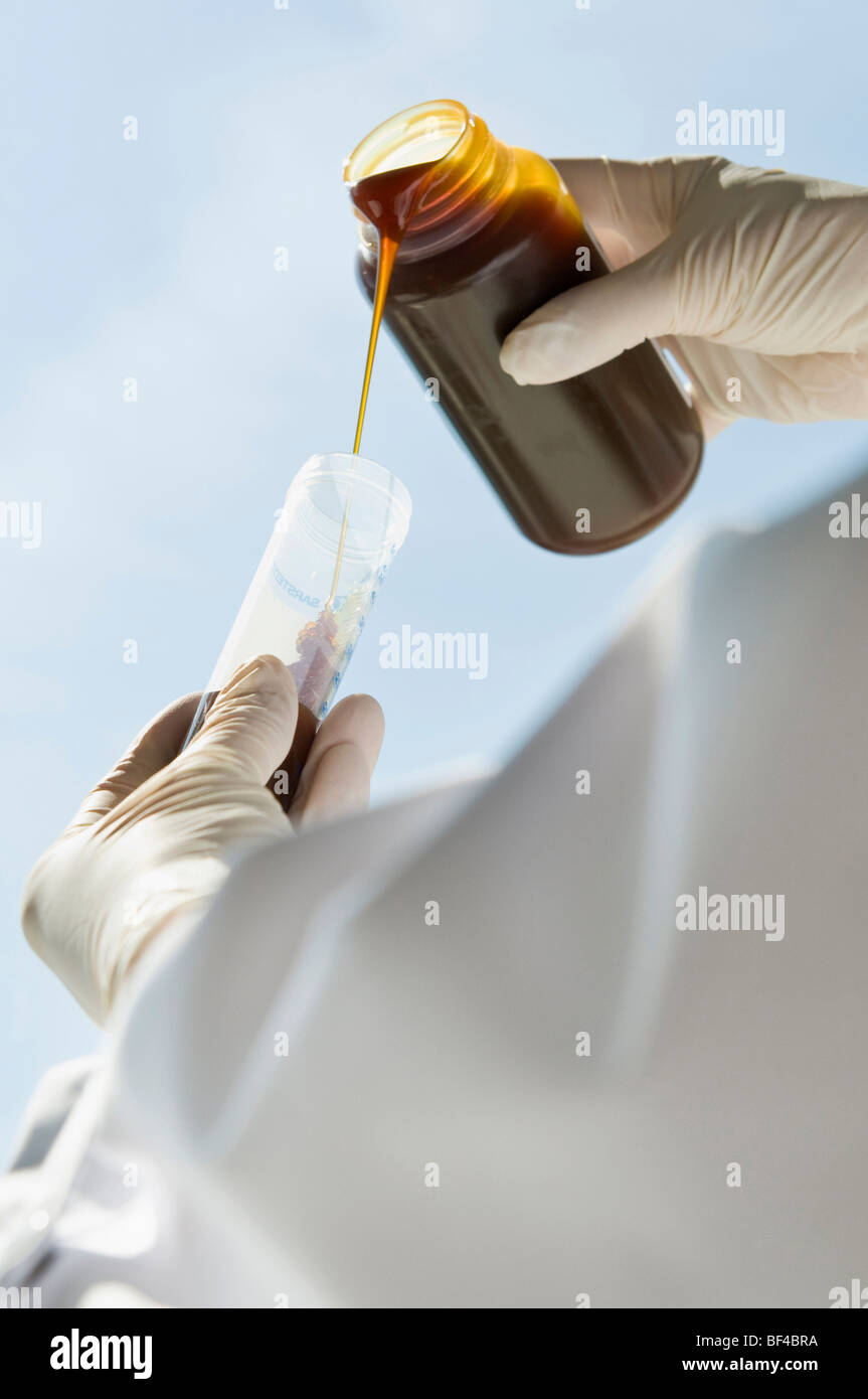 Liquid is decanted in a laboratory Stock Photo - Alamy