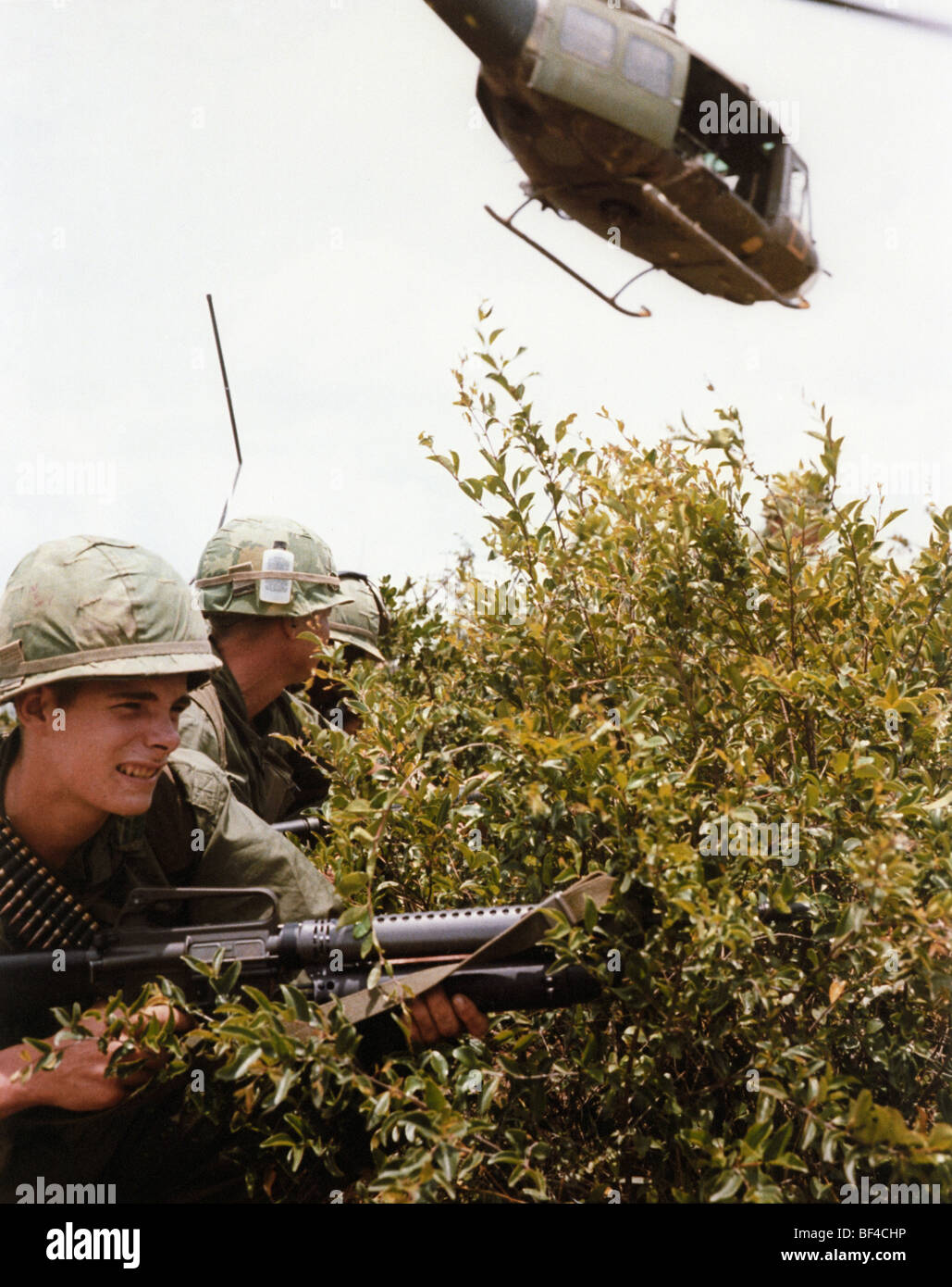 Infantry of B Troop, 1st Squadron, 9th Cavalry on patrol as a huey ...