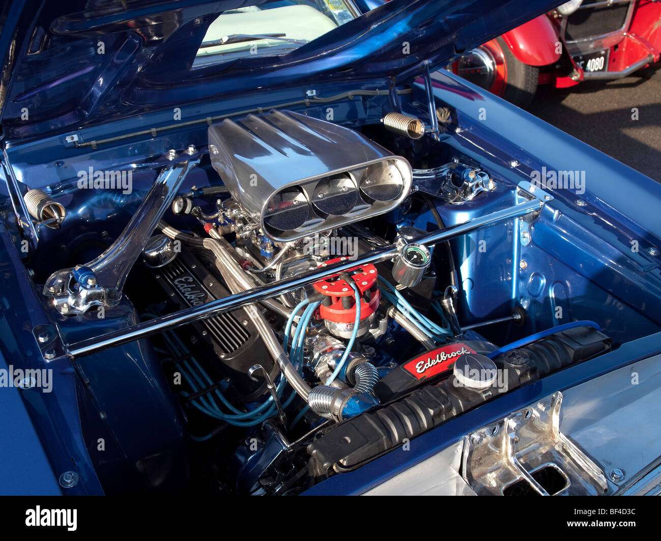 An immaculate V-eight engine in a blue and chrome Custom Saloon car at ...
