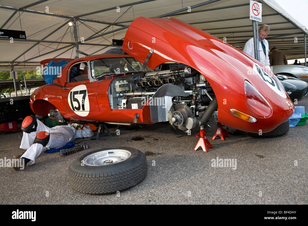 1961 Jaguar E-Type being worked on in the paddock by mechanic. RAC TT ...