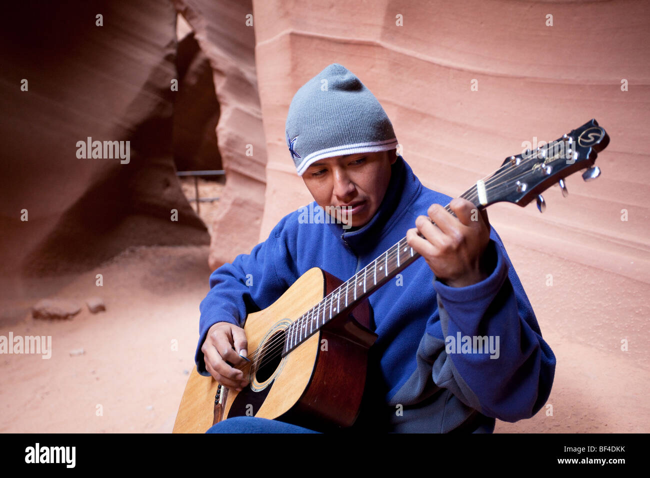 Young Navajo playing guitar in the Lower Antelope Canyon, Navajo Nation ...