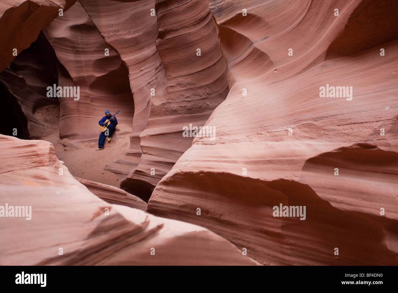 Young Navajo playing guitar in the Lower Antelope Canyon, Navajo Nation ...
