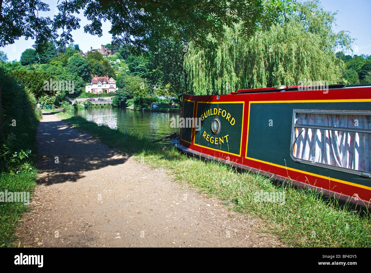 A green canal Narrowboat on the Wey & Arun Canal in Surrey, England UK ...