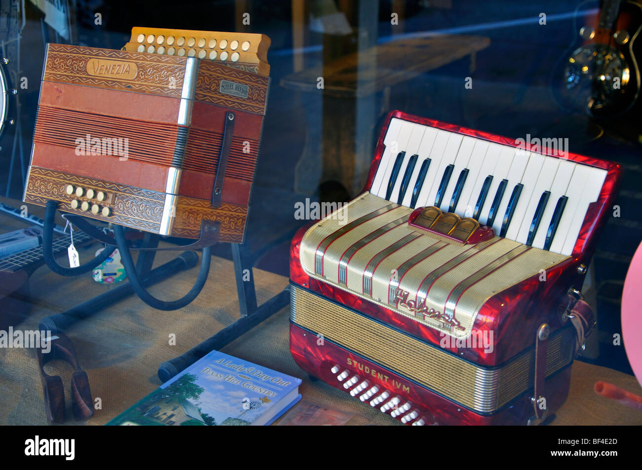 Musical instrument shop window Stock Photo - Alamy