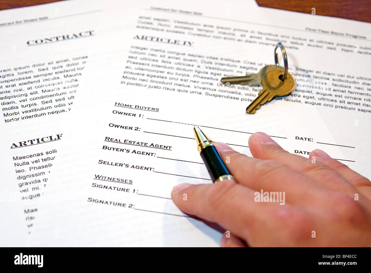 Signing a contract for the sale of a home Stock Photo - Alamy