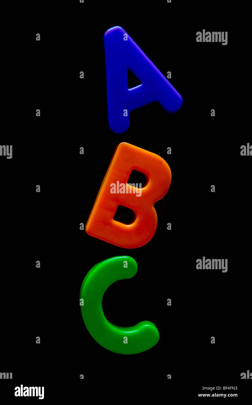 Letters of the alphabet isolated against a black background Stock Photo ...