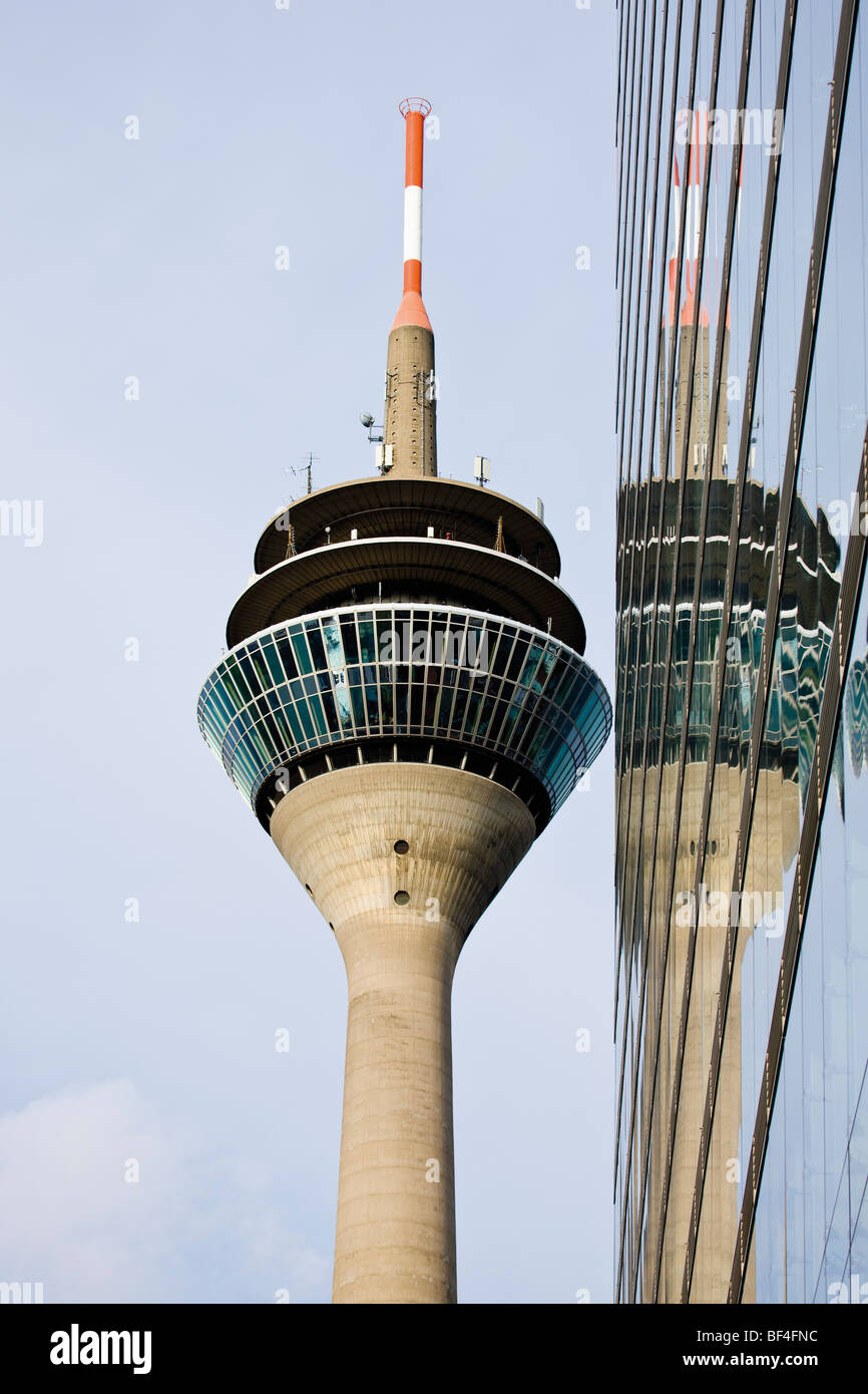 Rheinturm Rhine Tower with reflection in the glass facade of the ...