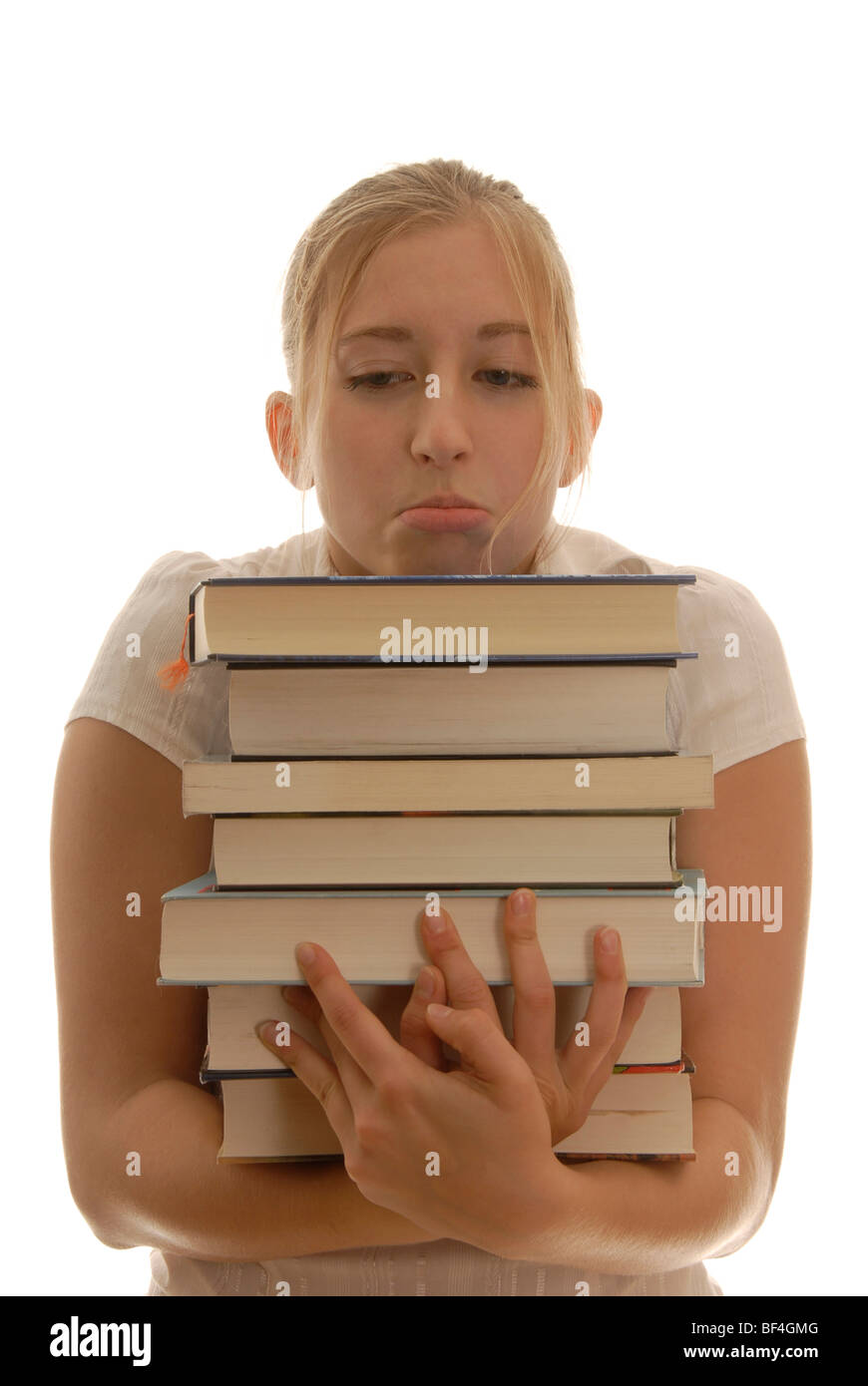 Eighteen year old woman with books, looking desperate, learning stress Stock Photo - Alamy