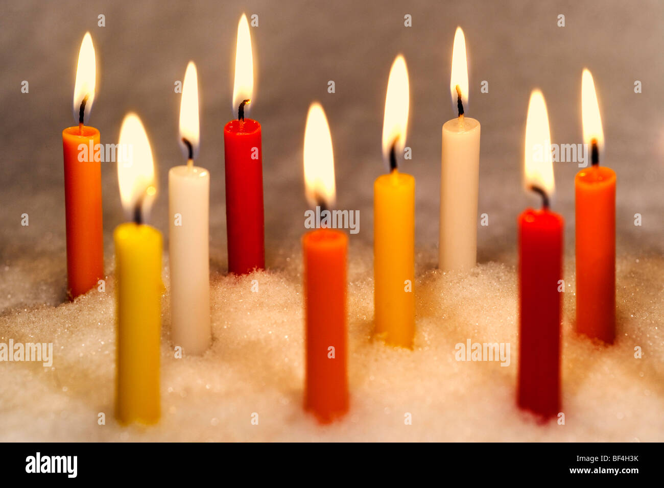 Burning coloured candles Stock Photo - Alamy