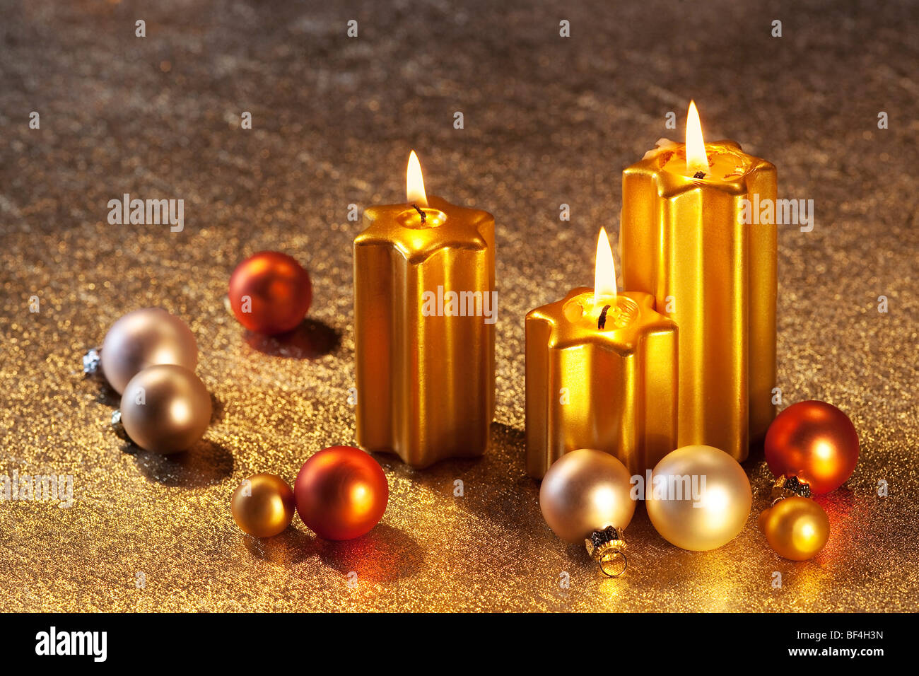 Burning golden candles with baubles for the Christmas tree Stock Photo ...