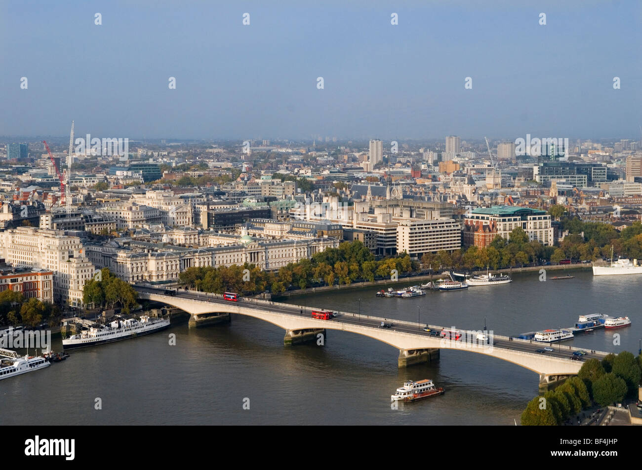Waterloo Bridge over the River Thames, London. Somerset House frontage ...