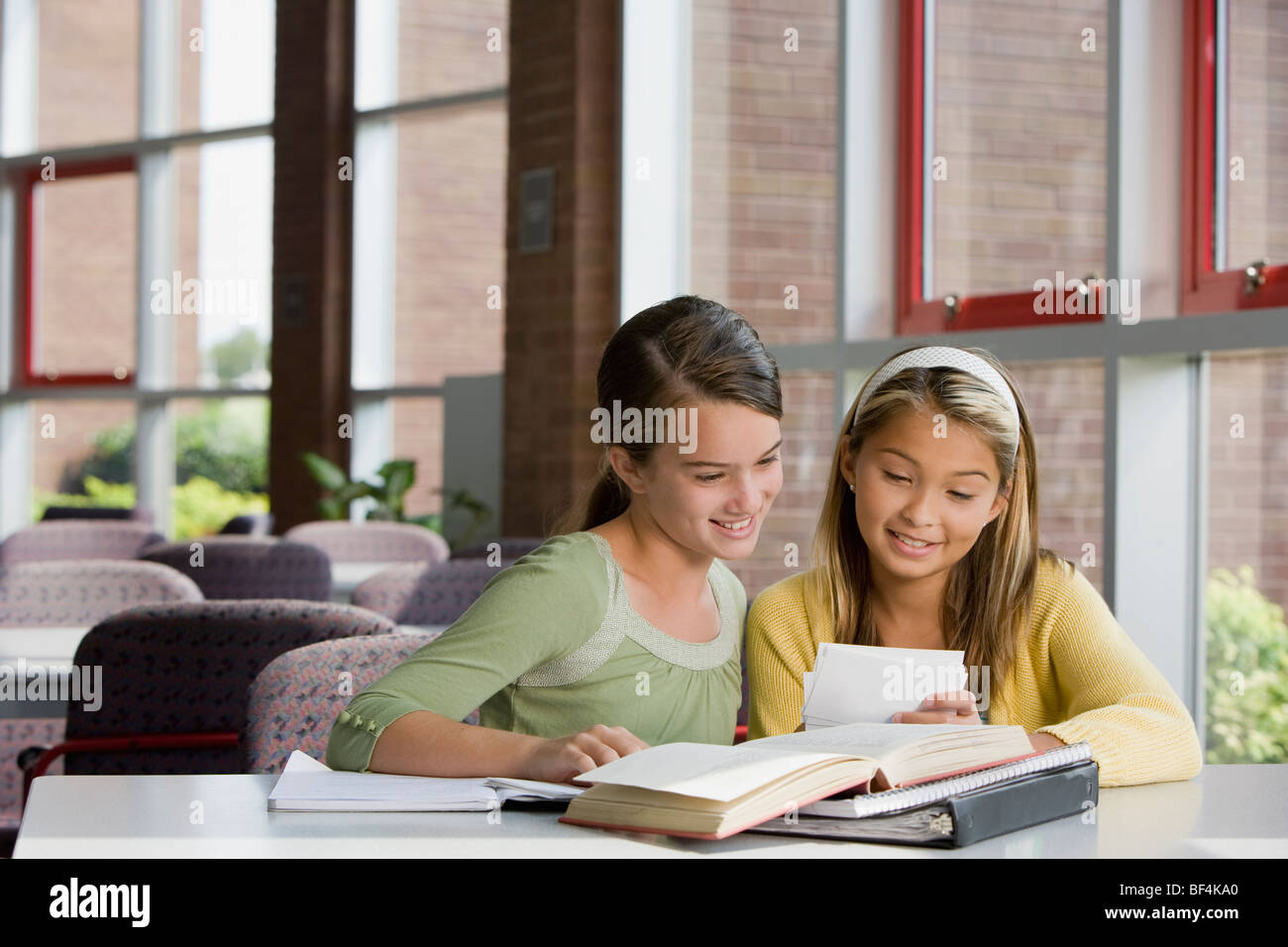 Girls doing homework Stock Photo - Alamy