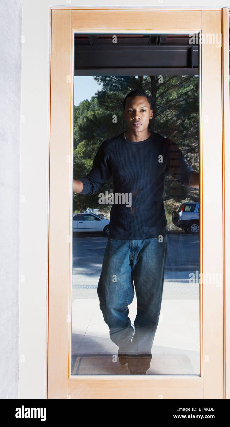 African man standing in doorway Stock Photo - Alamy