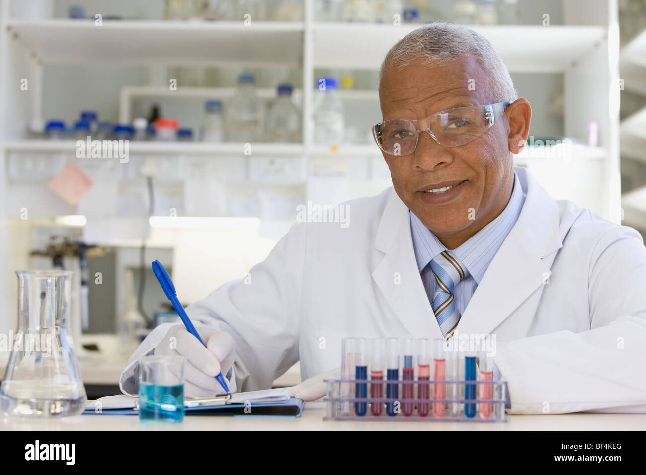 African scientist performing analysis in laboratory Stock Photo - Alamy