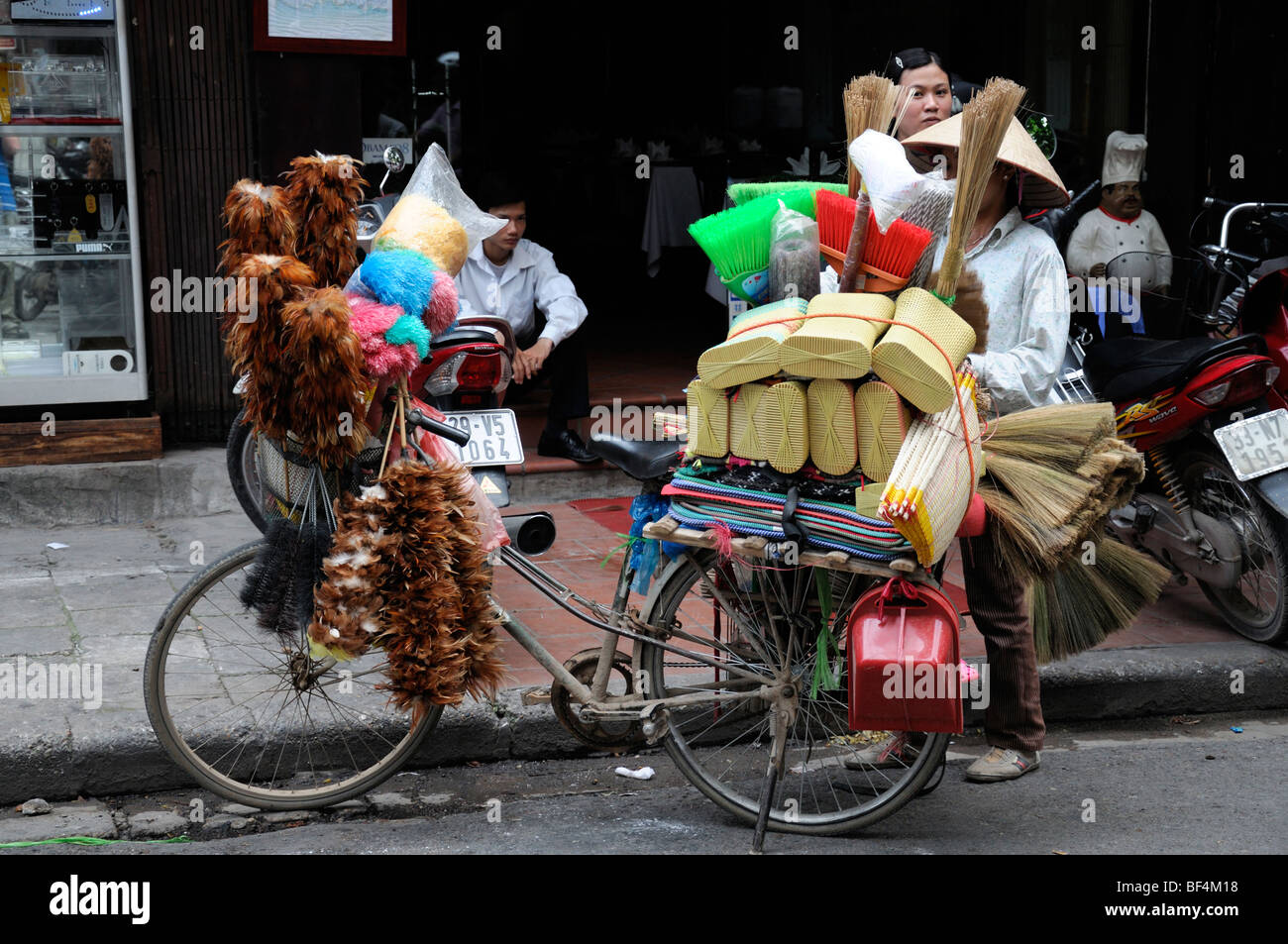 woman carrying transporting carry transport very heavy load overloaded ...