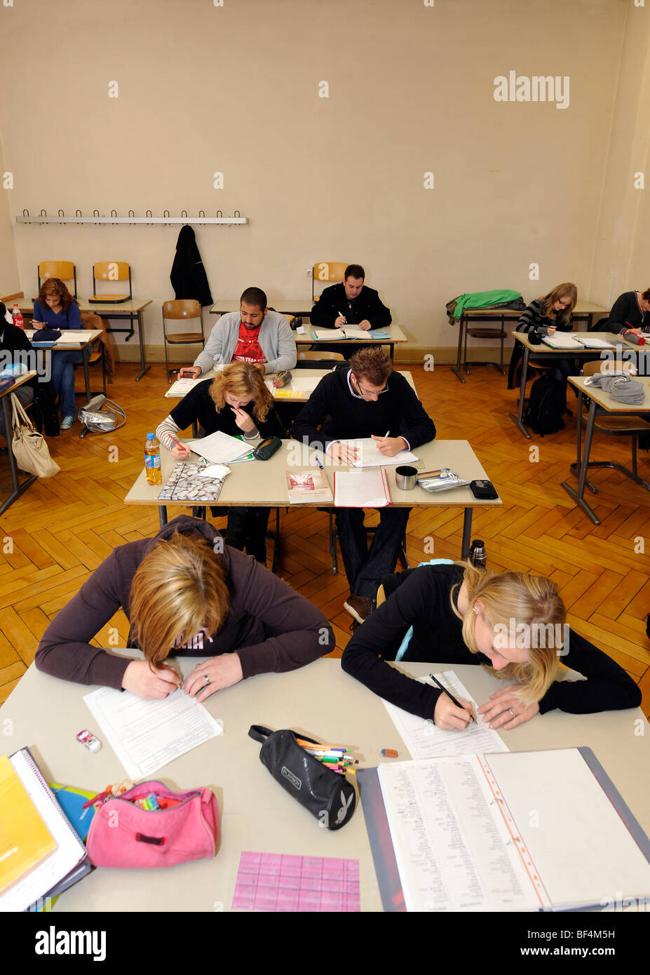 Pupils in a classroom, adult education Stock Photo - Alamy