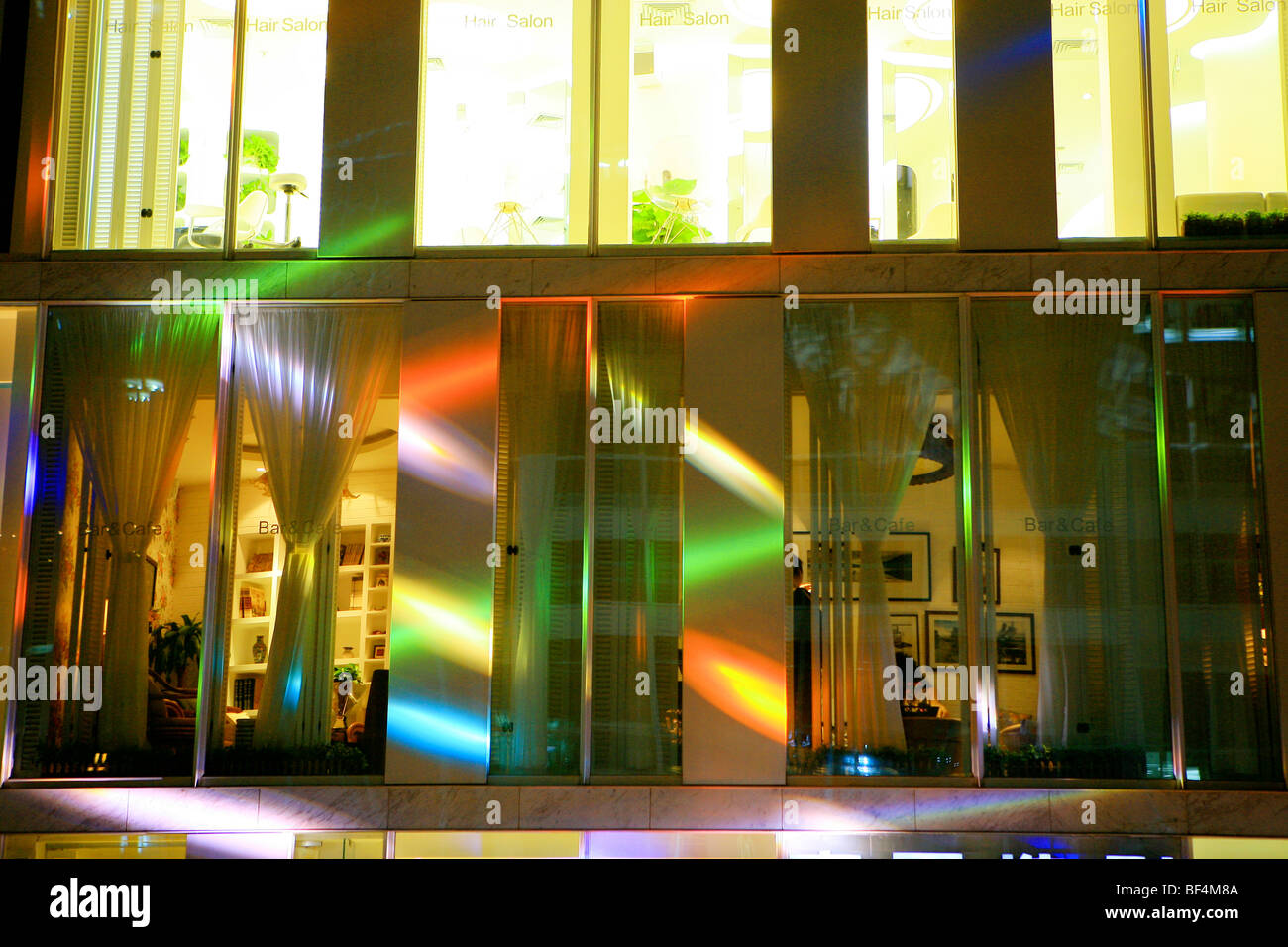 Neon lights reflected on the window of chic office of Tony's Studio in ...