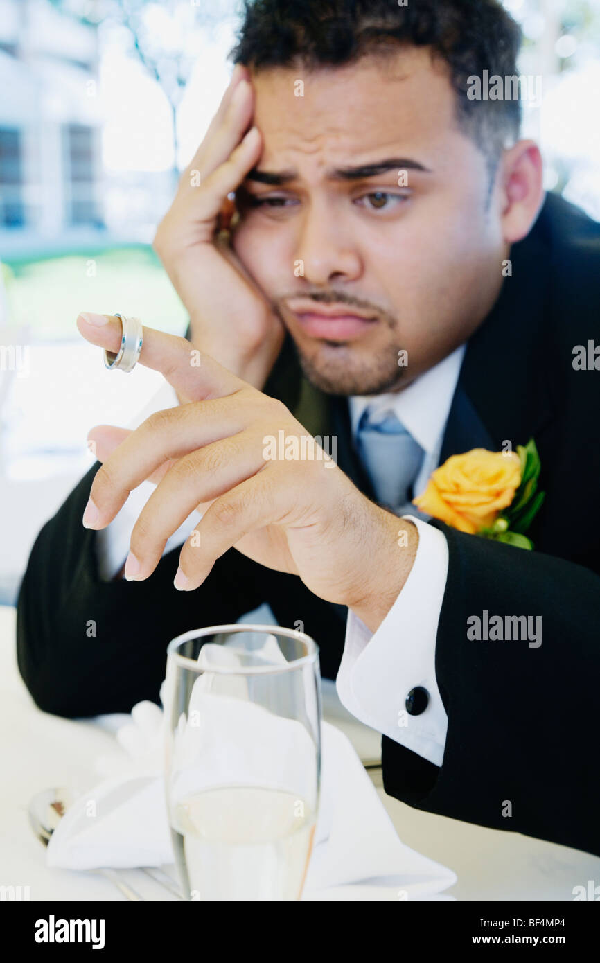 Hispanic groom looking sad Stock Photo - Alamy