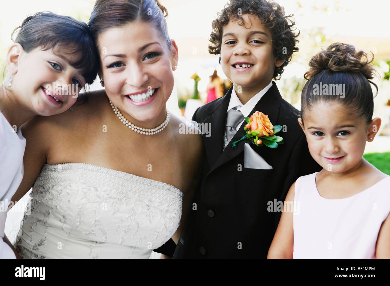 Bride and children hugging Stock Photo - Alamy