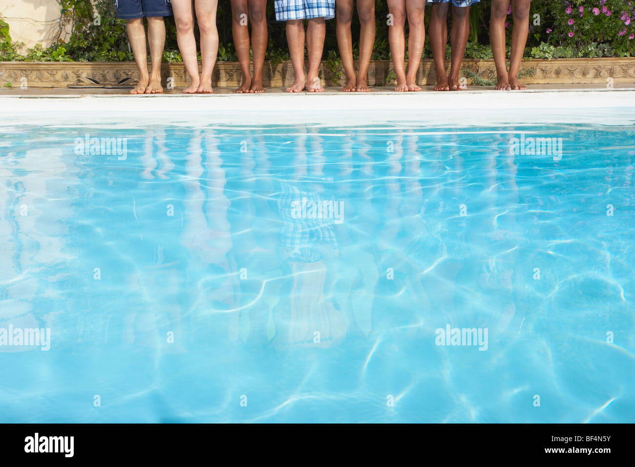 Multi-ethnic group of friends enjoying pool party Stock Photo - Alamy