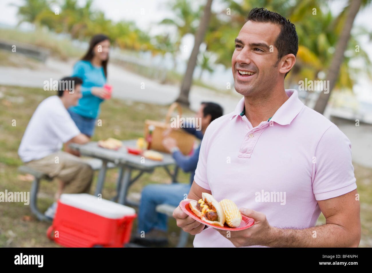 Hispanic friends enjoying barbecue Stock Photo - Alamy