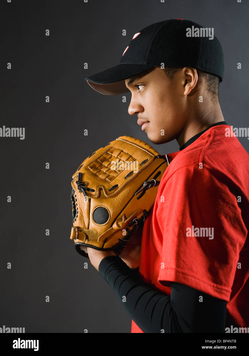 Mixed race baseball player looking serious Stock Photo - Alamy