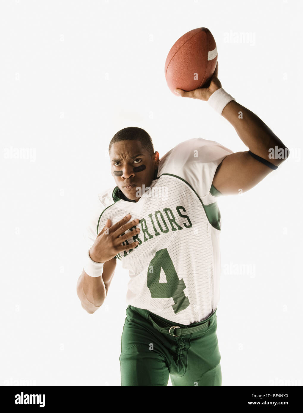 African quarterback throwing football Stock Photo - Alamy