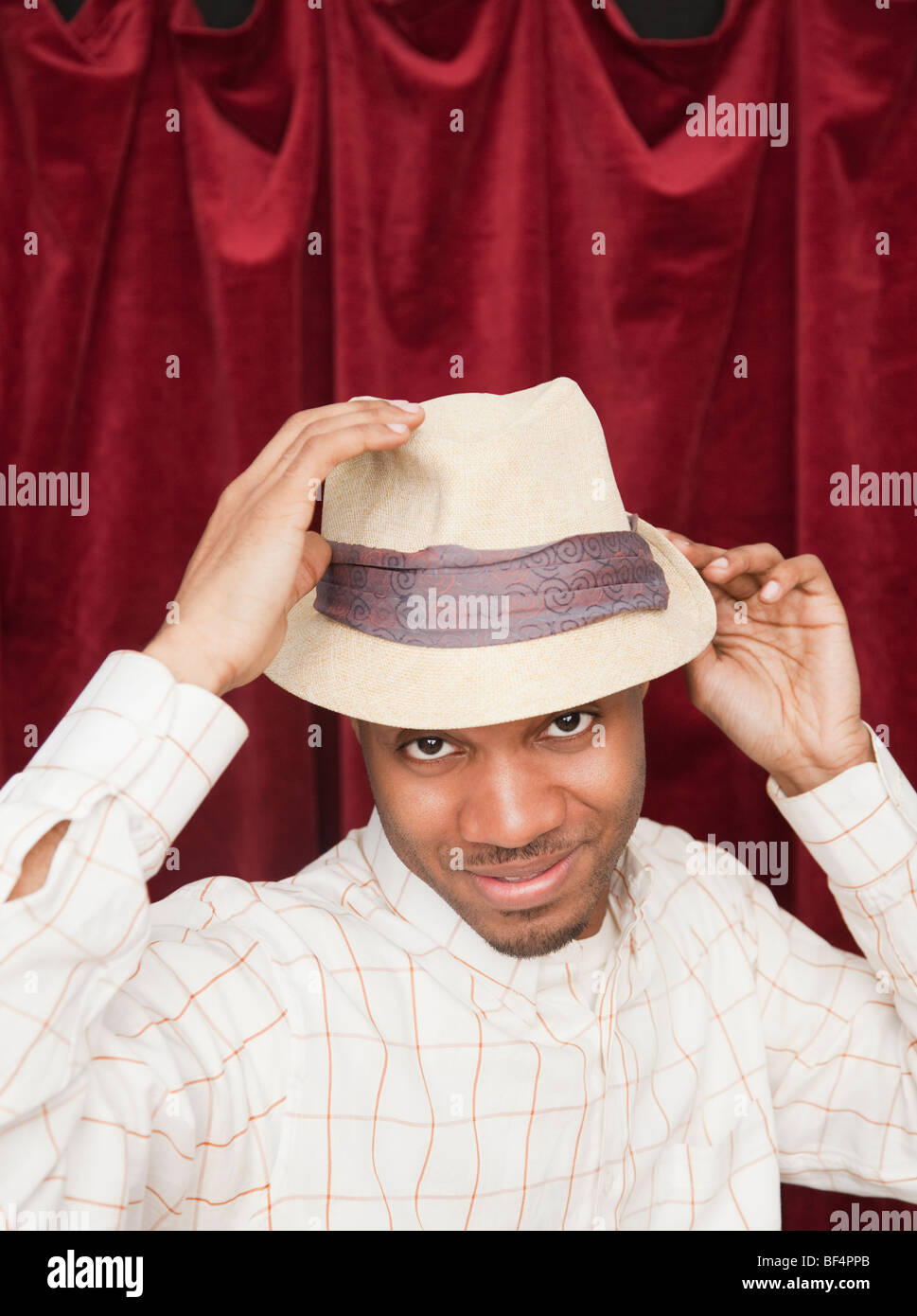 African man in hat acting cool Stock Photo - Alamy