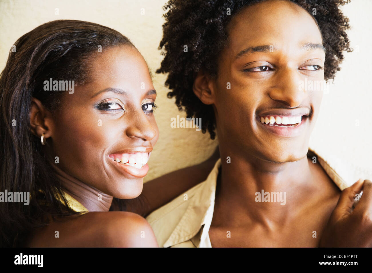 African couple hugging and smiling Stock Photo - Alamy