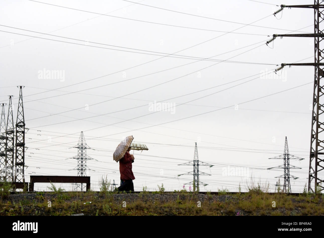 Women walking by power lines, Russian arctic, Russia Stock Photo - Alamy