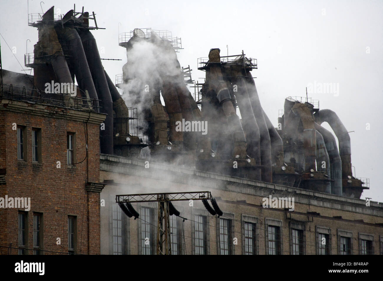 Industrial coal mining building with smoke and industrial pipes, detail ...