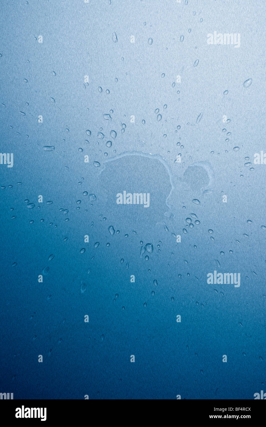 Puddle of water with splashes Stock Photo - Alamy