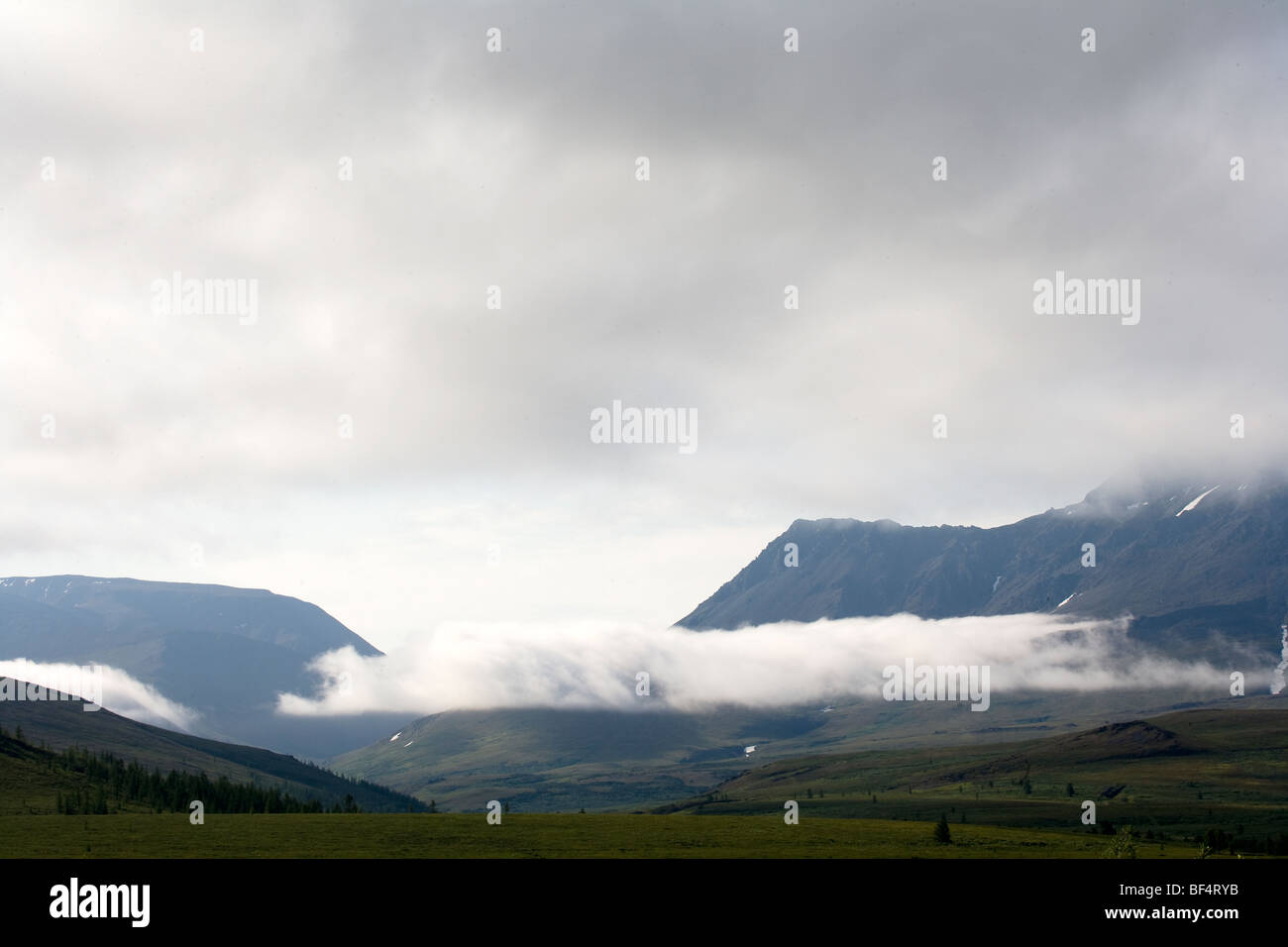 Mountain valley landscape with storm clouds and mist, Polyarny, Arctic ...