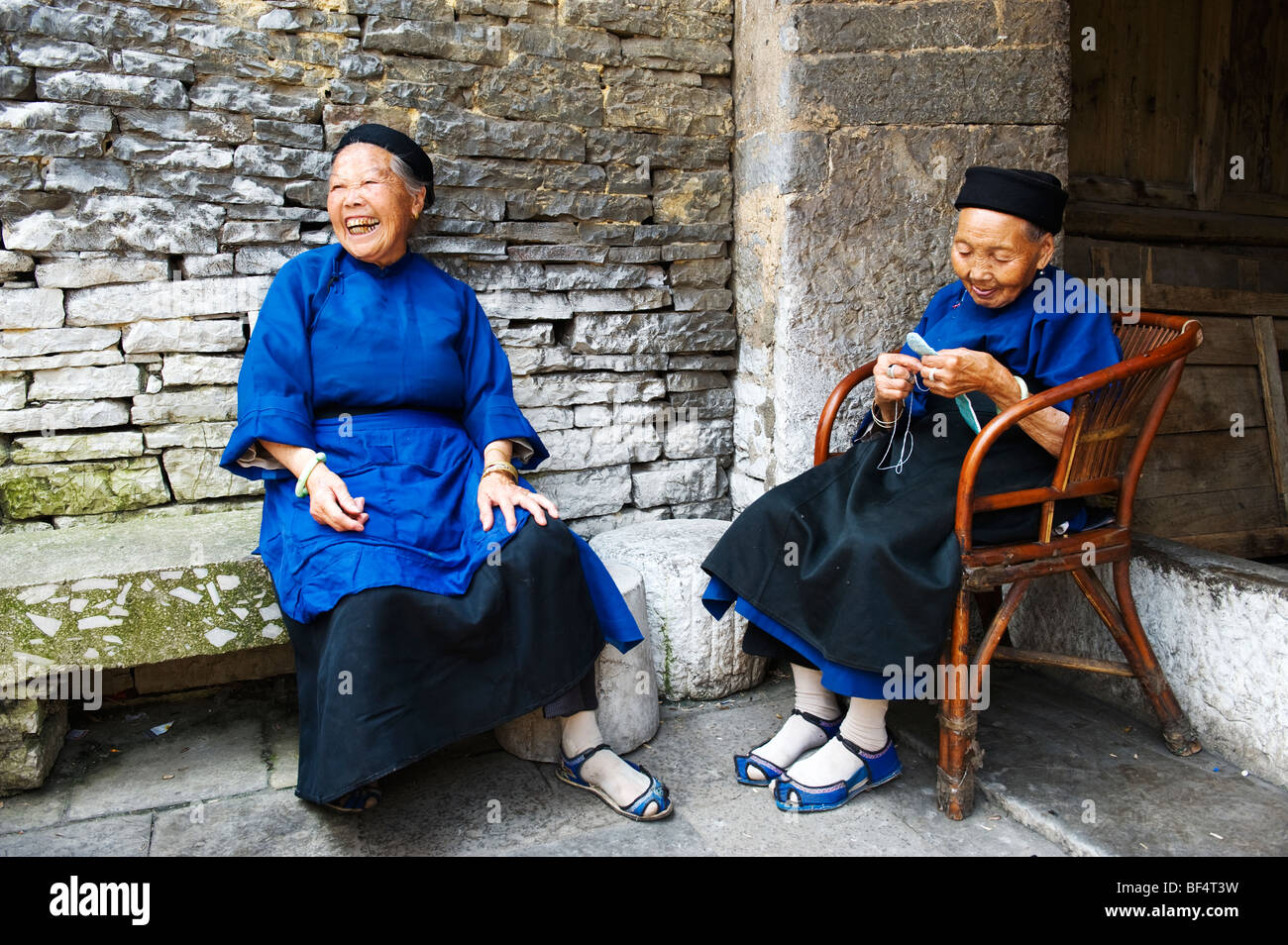 Two elderly Dong women sewing, Zhaoxing Dong Village, Qiandongnan Miao ...