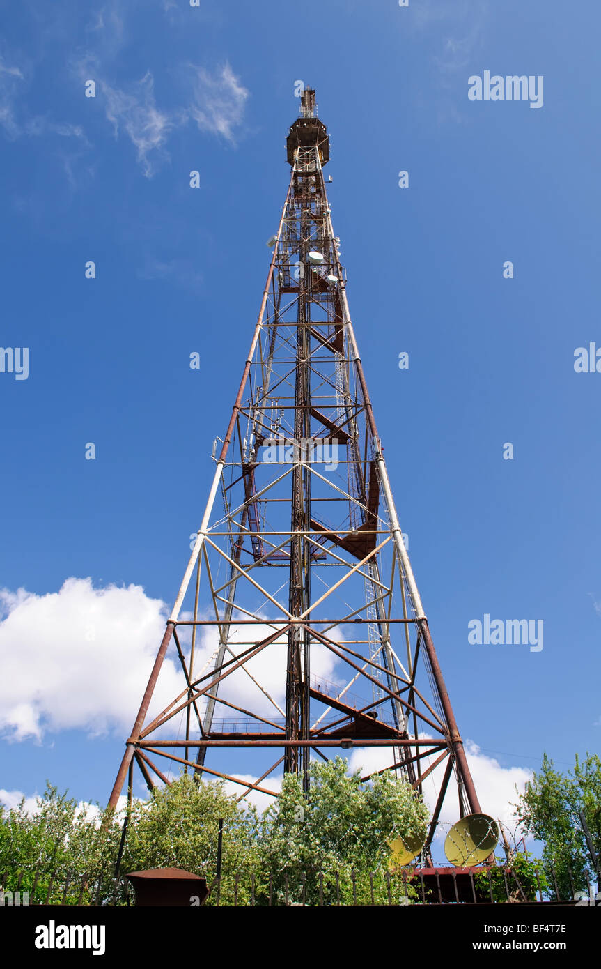 Telecommunication mast over blue sky background Stock Photo - Alamy