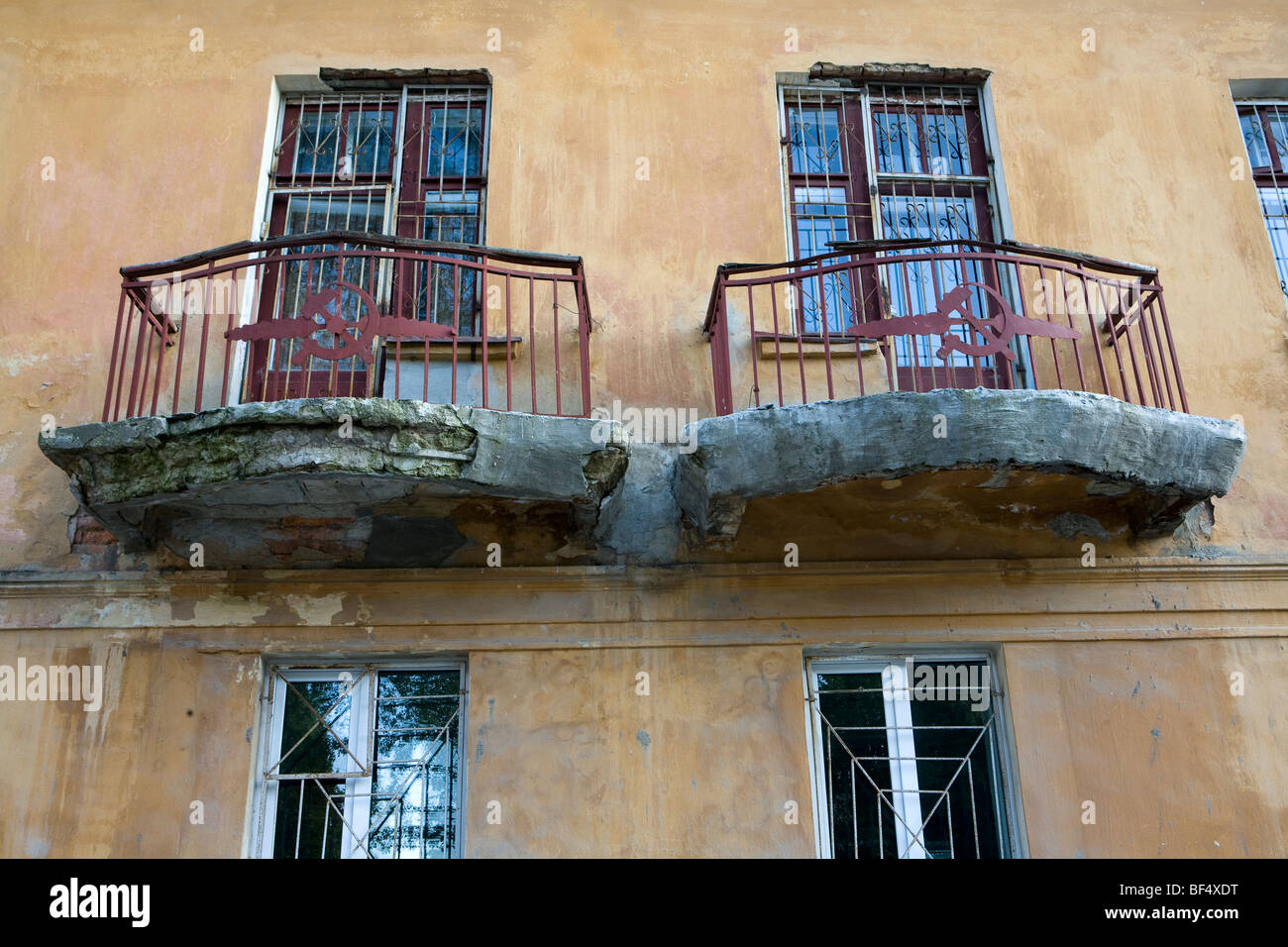 Russian apartment building with metalwork hammer and sickle symbols on ...